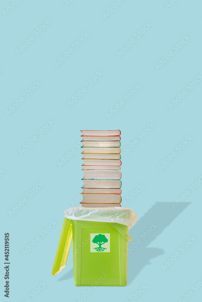 Cover page with green garbage trash bin with bag and a pile of ...