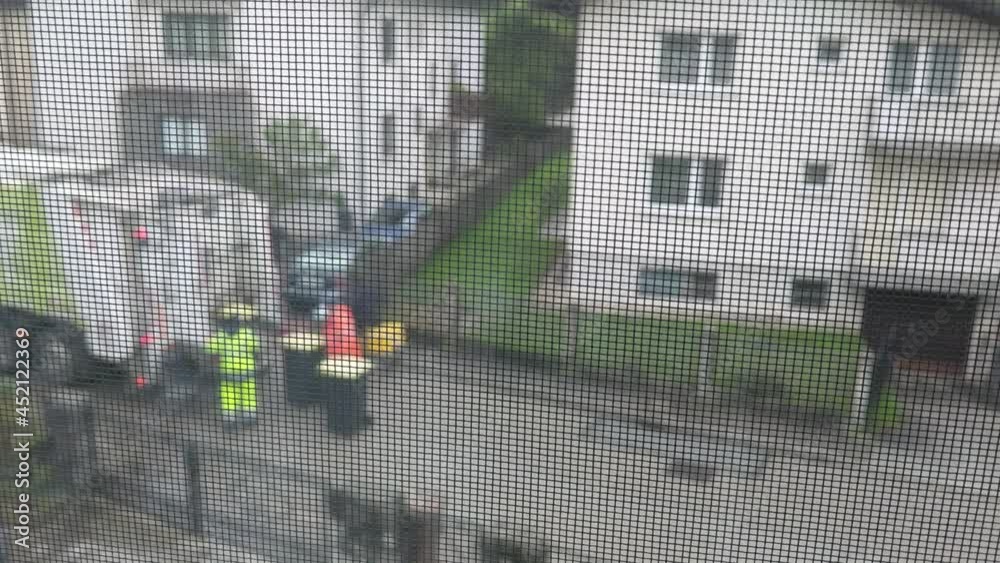 Vidéo Stock Garbage truck and workers collecting trash bins on the ...