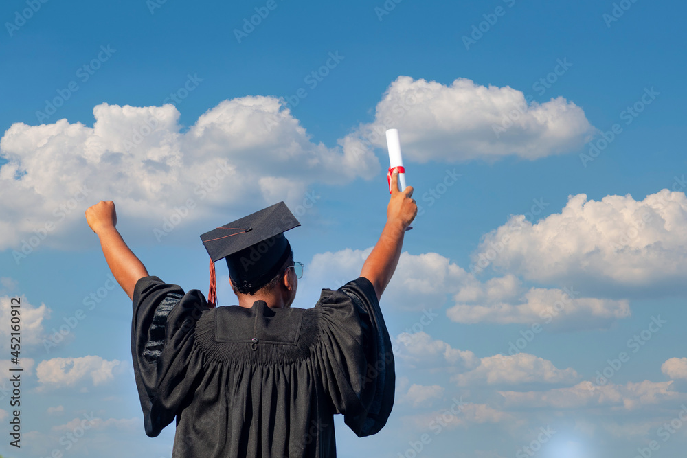The graduates raised their hands to celebrate graduation with a ...