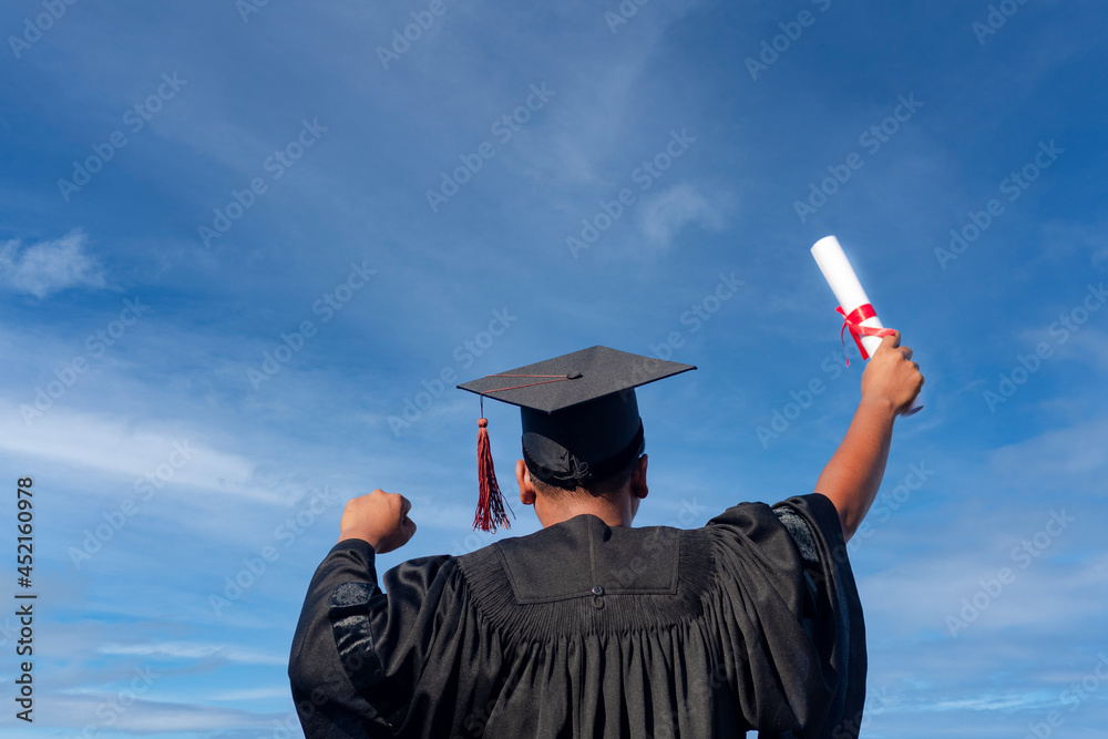 The graduates raised their hands to celebrate graduation with a ...