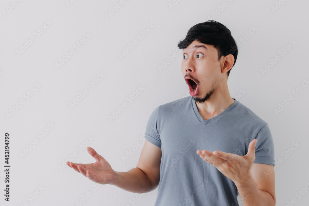 Shocked and surprised face of Asian man in isolated on white background ...