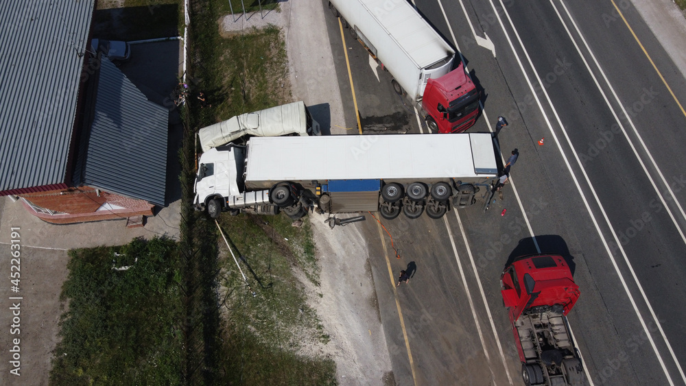 Top view of a car accident involving a truck and a bus. Filming from a ...