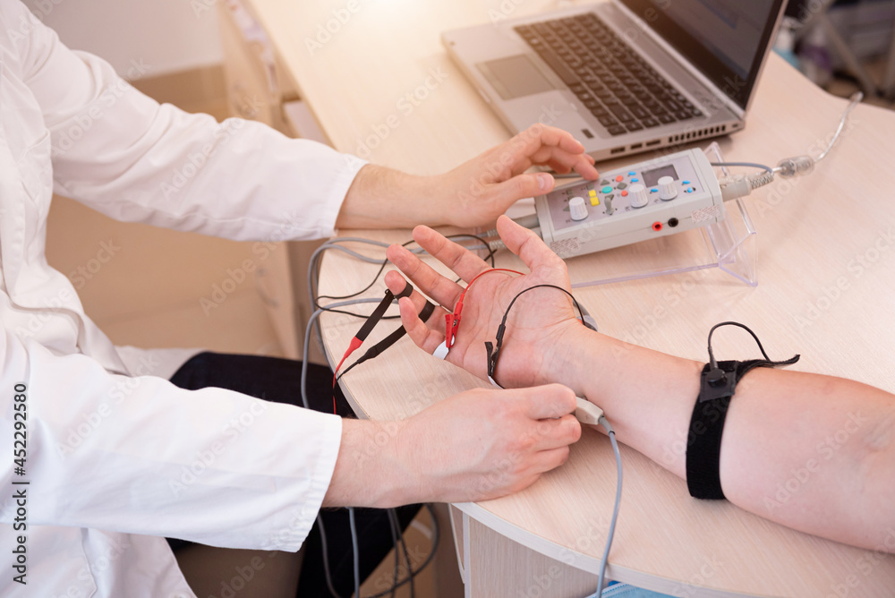 Patient nerves testing using electromyography at medical center Stock ...
