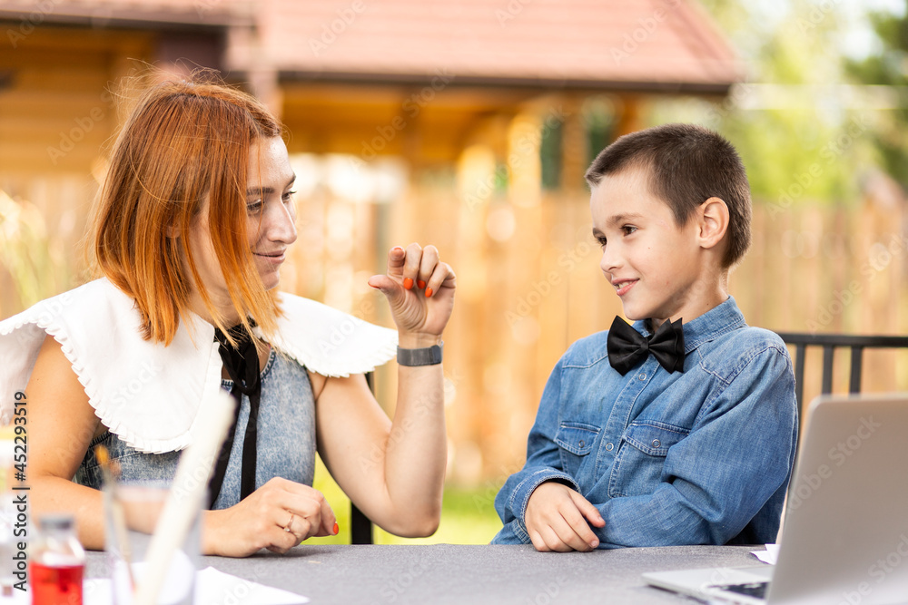 Mom shows her son the size of the necessary substance for home chemical ...
