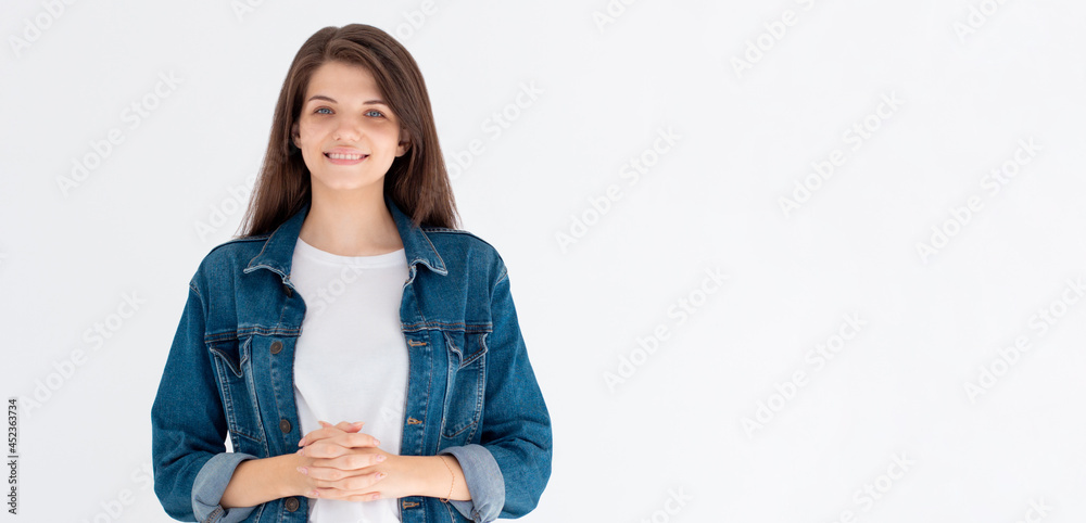 Pretty smiling joyfully female, dressed casually, looking with ...