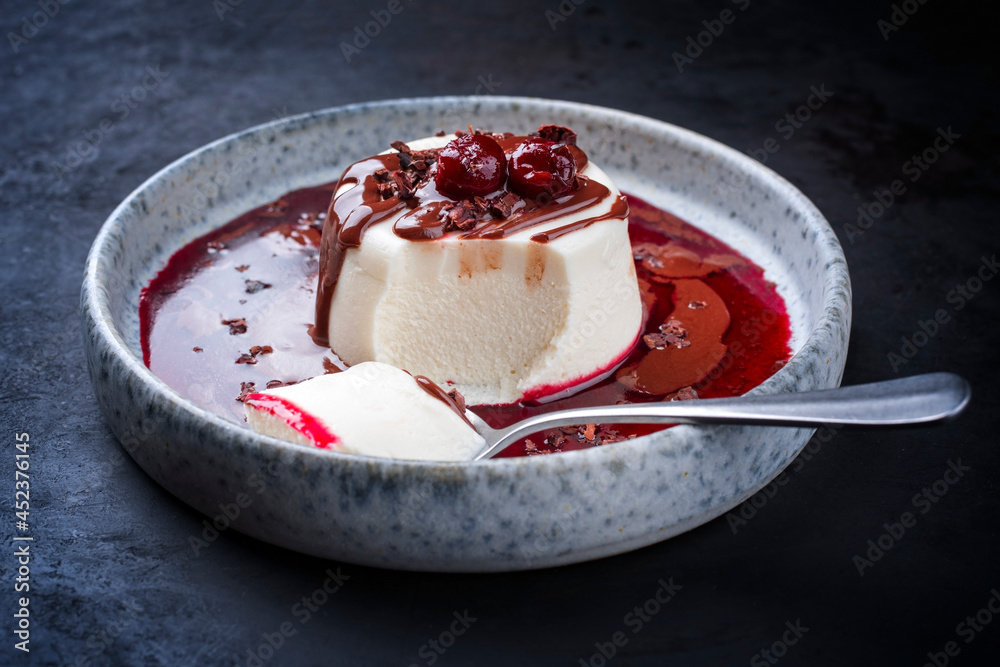 Modern style traditional blancmange almond pudding with cherry ...