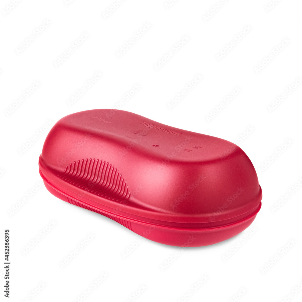 Tupperware plastic container. Plastic red food box closed with lid ...