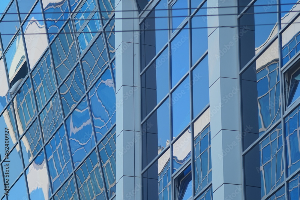 Photo of an urban texture. Part of the facade of a new office building ...