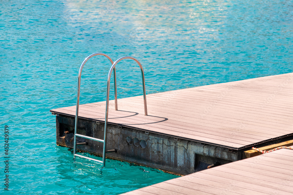 floating dock with composite deck and ladder at the marina. Stock Photo ...