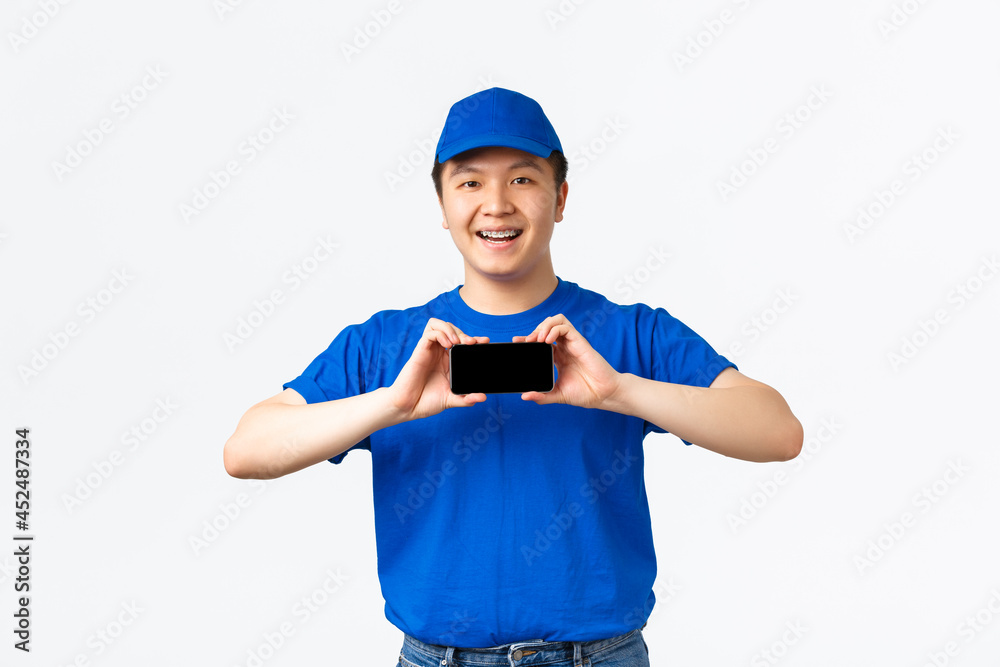 Technology, online shopping and shipping concept. Smiling friendly ...