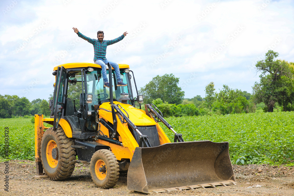 Indian man working with heavy equipment vehicle at construction site ...
