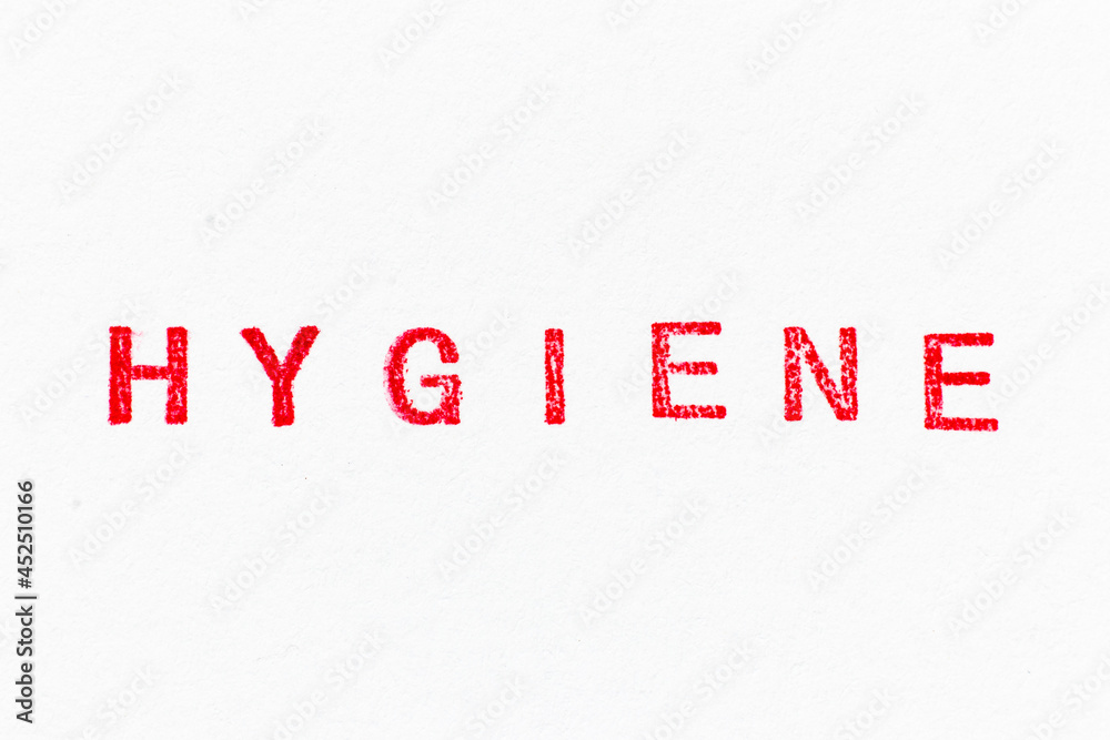 Red color ink rubber stamp in word hygiene on white paper background ...