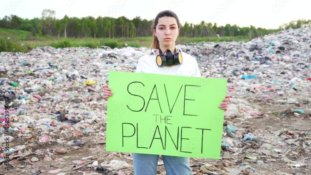 Vidéo Stock portrait young woman activist with a poster in hands save ...
