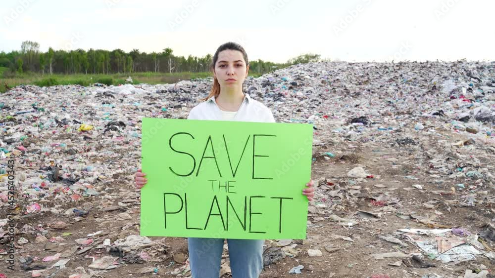 portrait young woman activist with a poster in hands save earth stands ...
