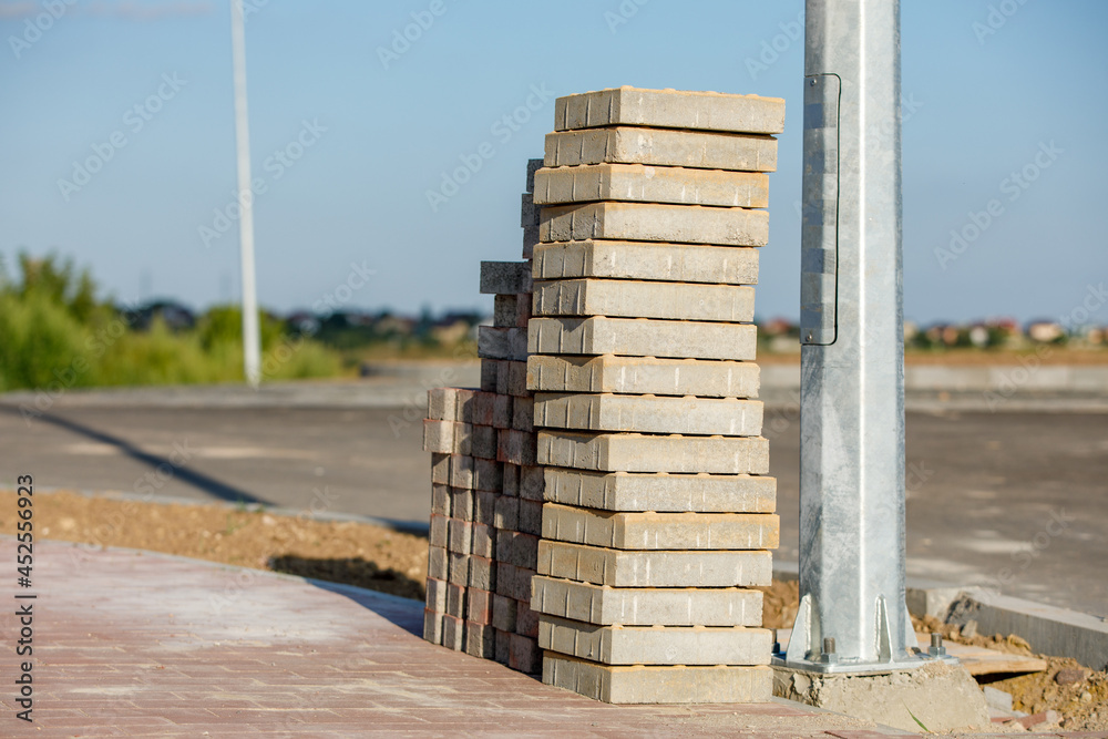 renewal of pavement. bricks of paving slab ready for construction works ...