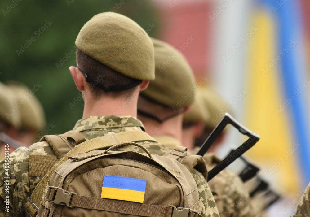 Ukrainian soldier. Ukrainian in army. Ukrainian flag on military ...