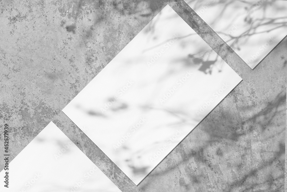 Three empty white vertical rectangle poster or card mockups lying ...