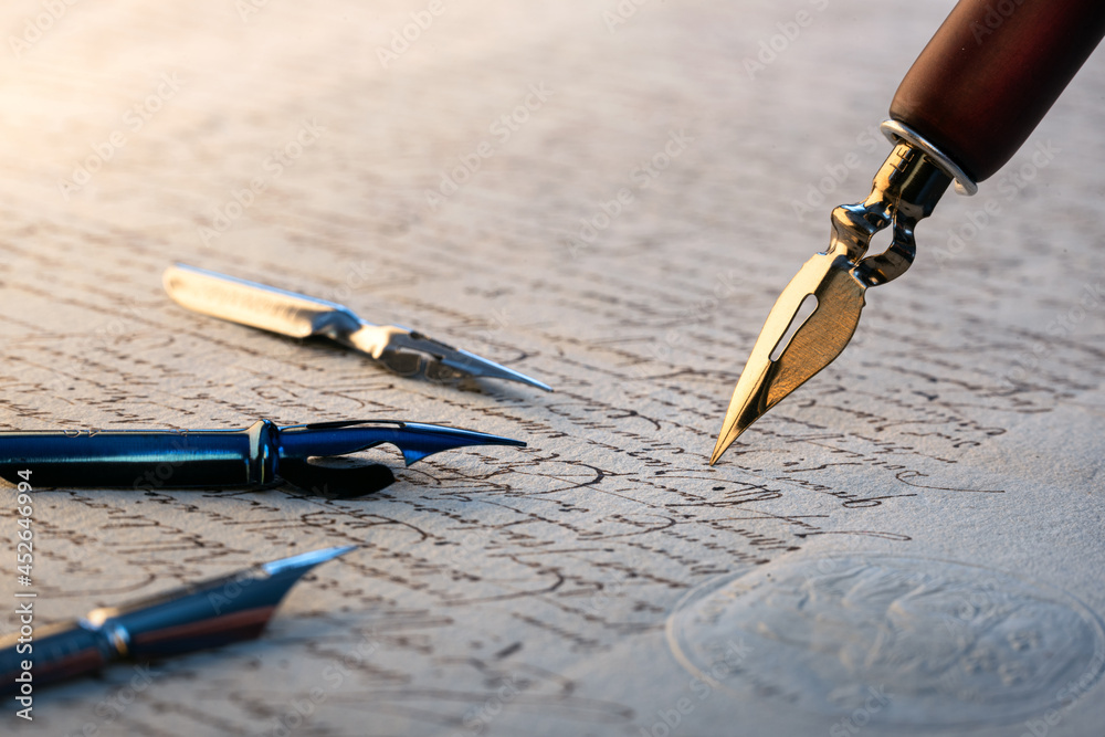 Fountain pen on an antique handwritten letter. Vintage nib pen and ...
