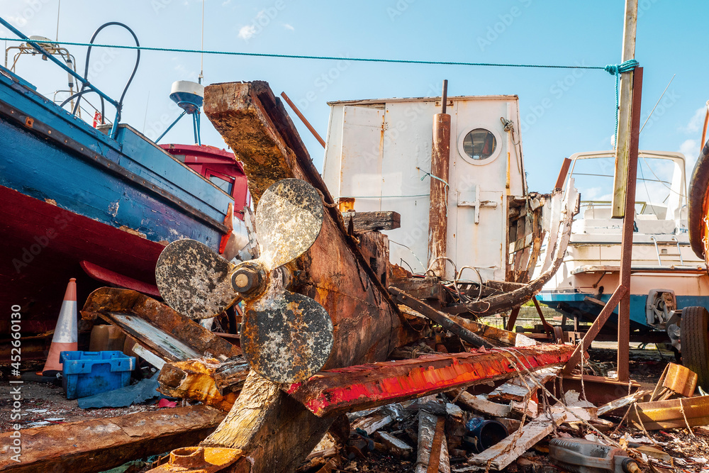 Small fishing boat wreck in a ship yard Stock Photo | Adobe Stock