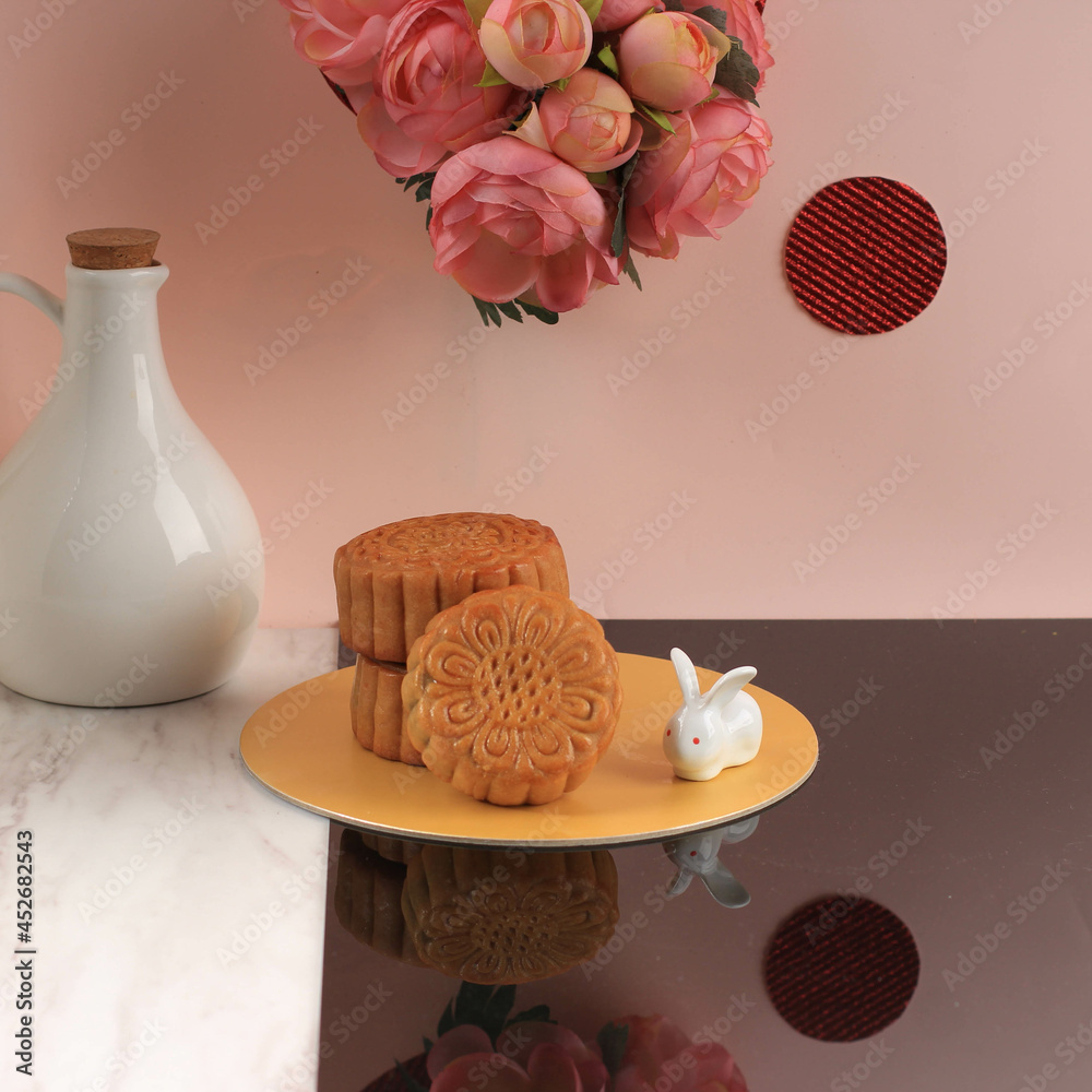 Mooncake on Light Pink Background with Pink Flower. Concept Moon Cake ...