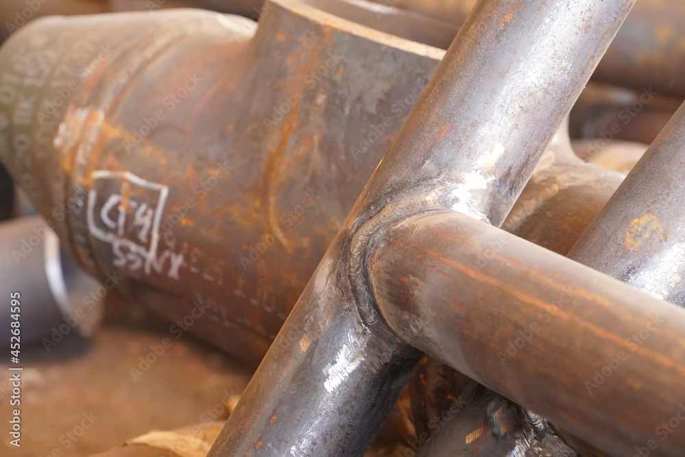 Butt weld of welding of a pipeline DN50 to a tee and a pipe. Oil and ...