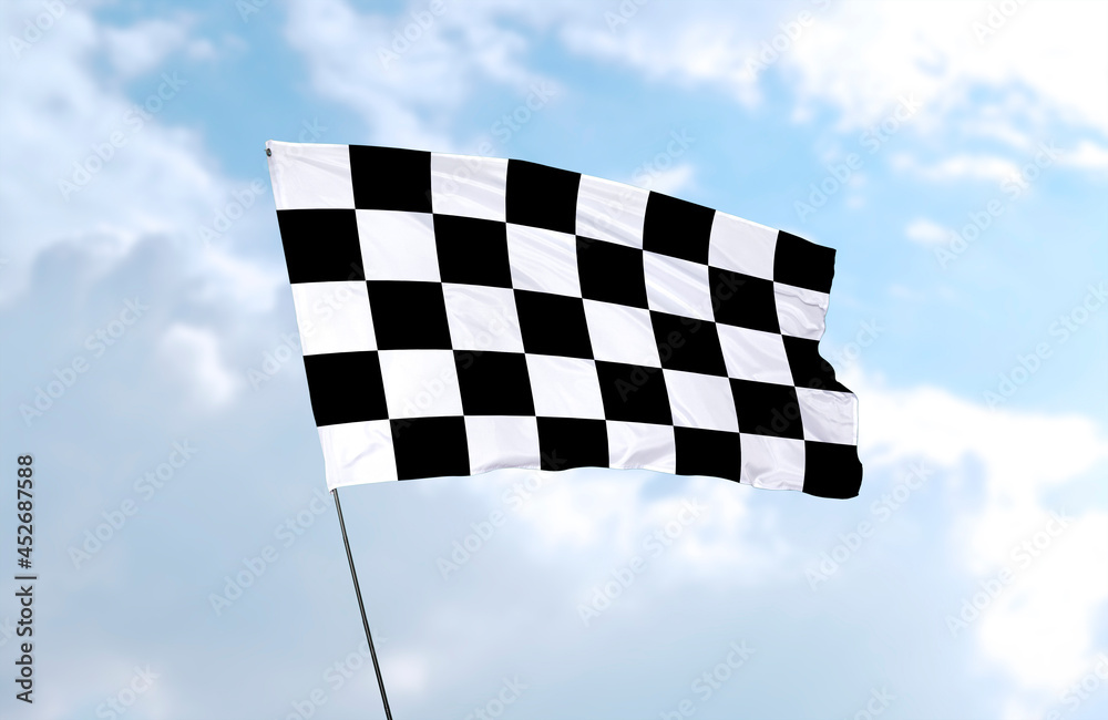 Racing flag (checkered flag), realistic 3d rendering in front of blue ...