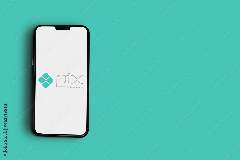 Pix logo on smartphone screen on green background. Pix is the new ...