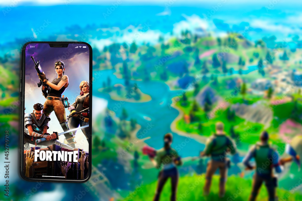 Fortnite game app on the smartphone screen with the game screen blurred ...