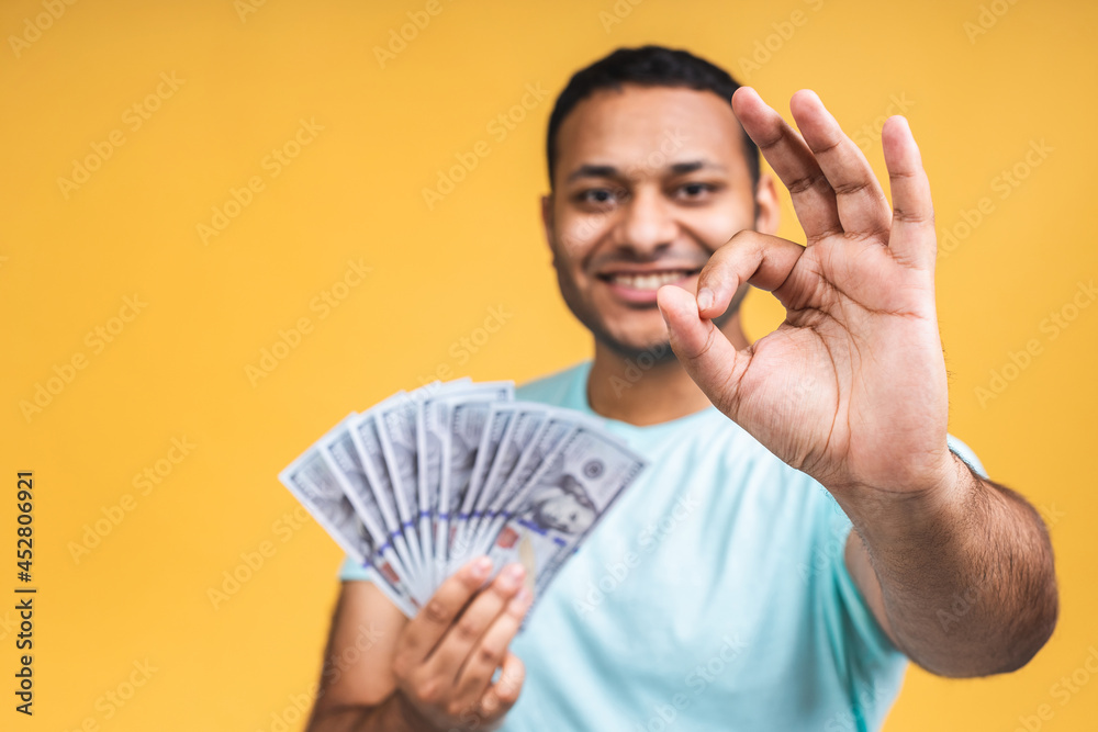 Winner! Young rich happy african american indian black man in casual ...