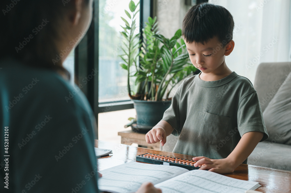 Asian mother teaching child boy Learning math with an abacus, education ...