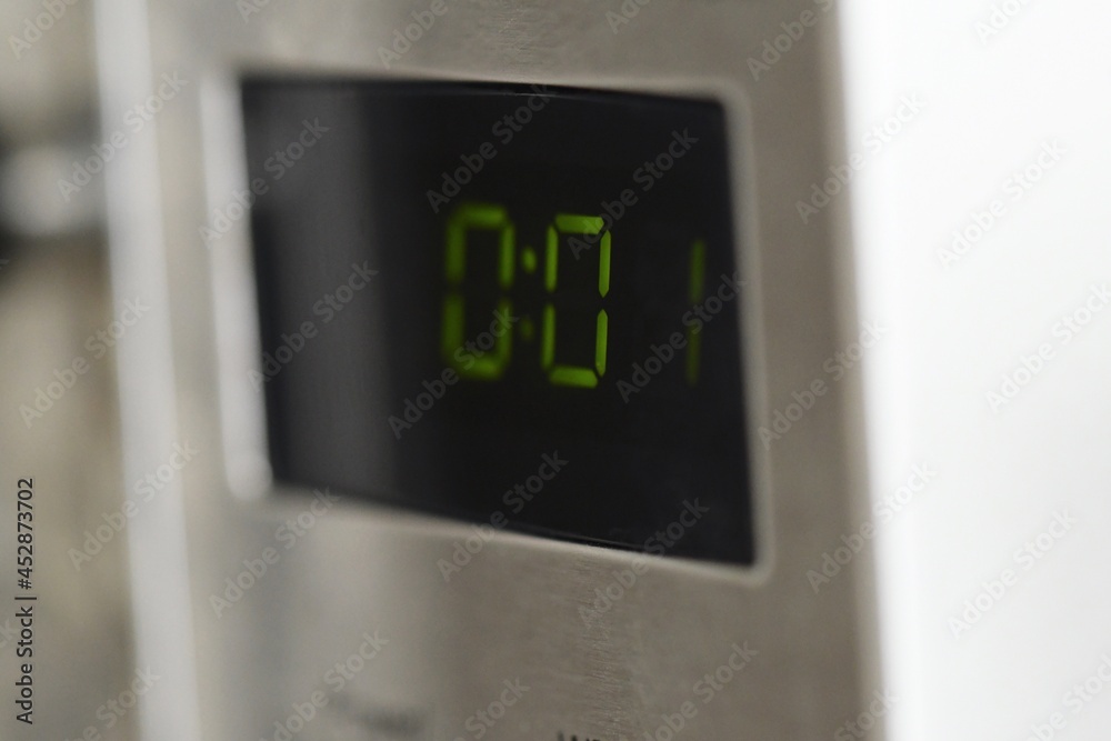 Closeup macro of numbers on a microwave Stock Photo | Adobe Stock