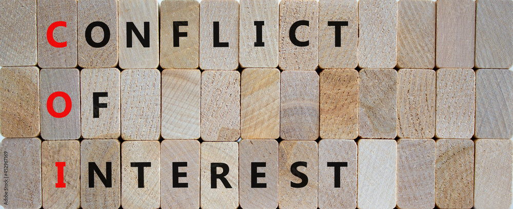 COI, Conflict of interest symbol. Wooden blocks with concept words 'COI ...