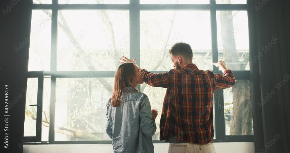 Bright future together. Rear view happy young romantic couple talk ...