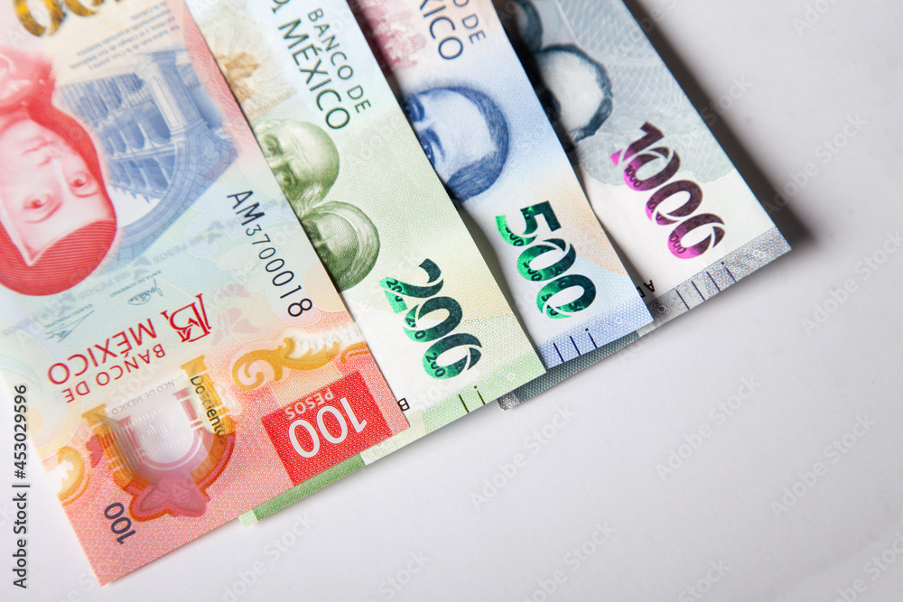 new bank notes of mexican peso background. 100, 200, 500, 1000 pesos ...