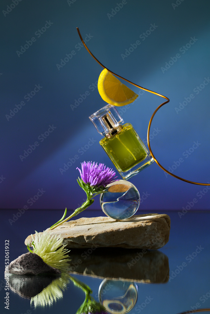 Mock up in blue concept background with glass perfume bottle. Stone ...