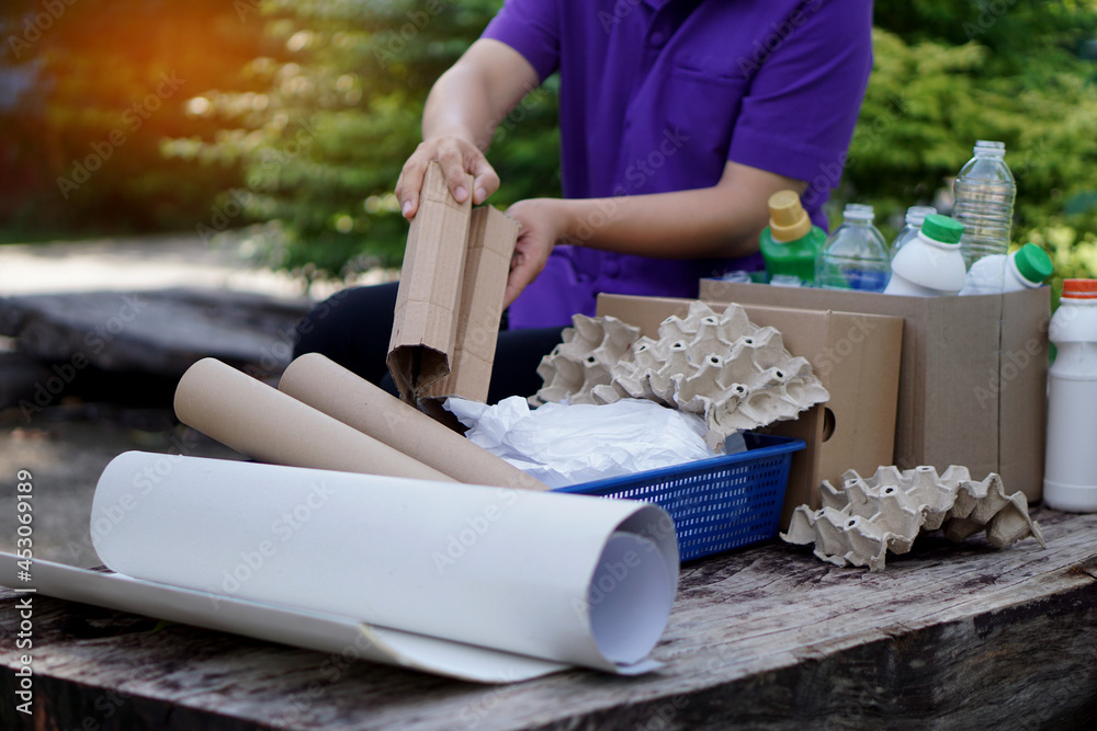 Concept : categorize type of garbage. Housekeeper is separating ...