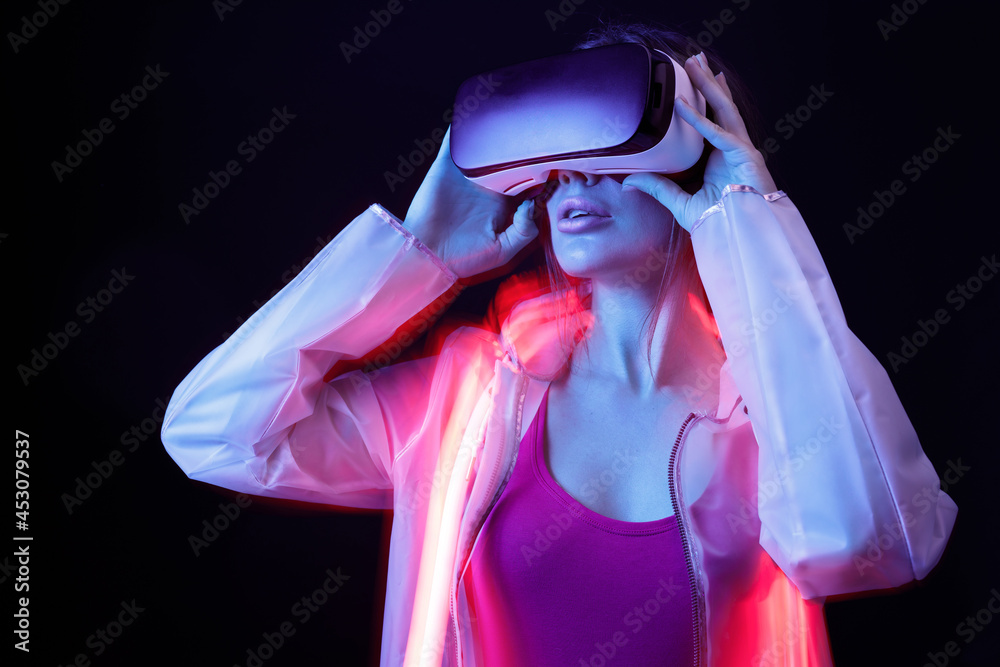 Woman in futuristic costume. Girl in glasses of virtual reality ...
