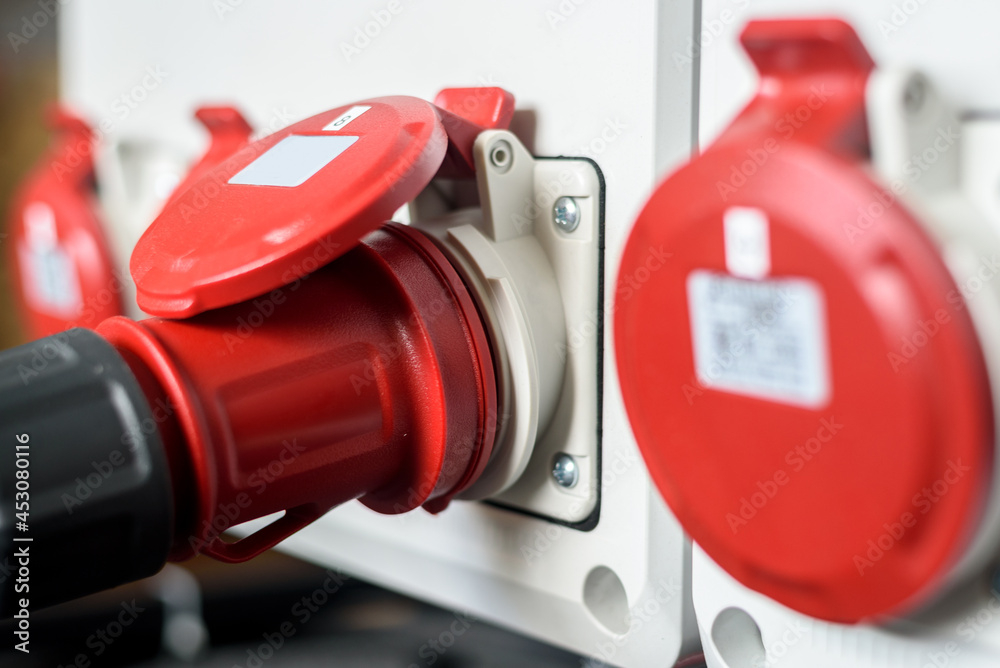 Industrial sockets and plug on distribution board. Construction site ...