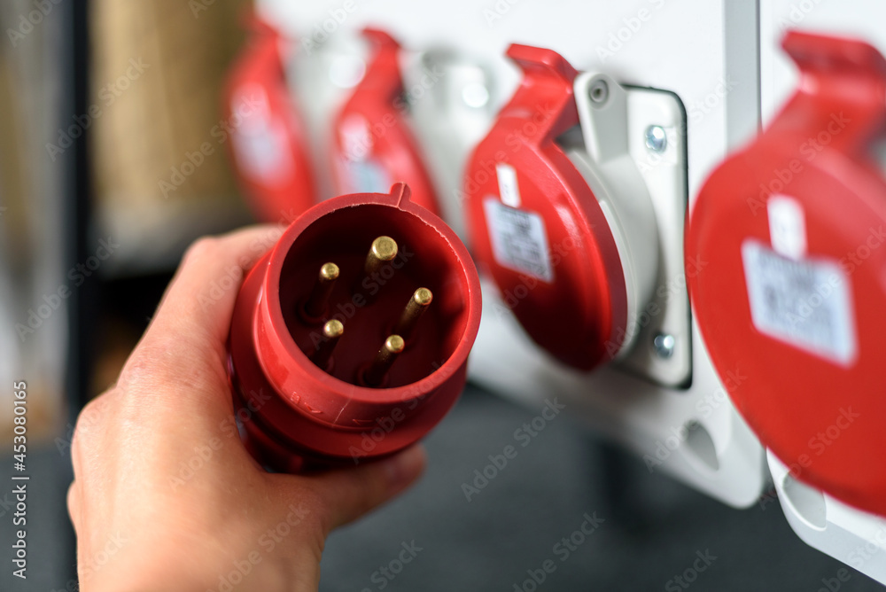 Industrial sockets and plug on distribution board. Construction site ...