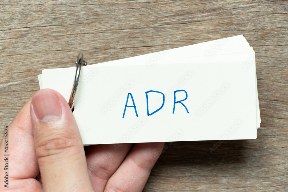 Man hold the flash card with handwriting word ADR (Abbreviation of ...