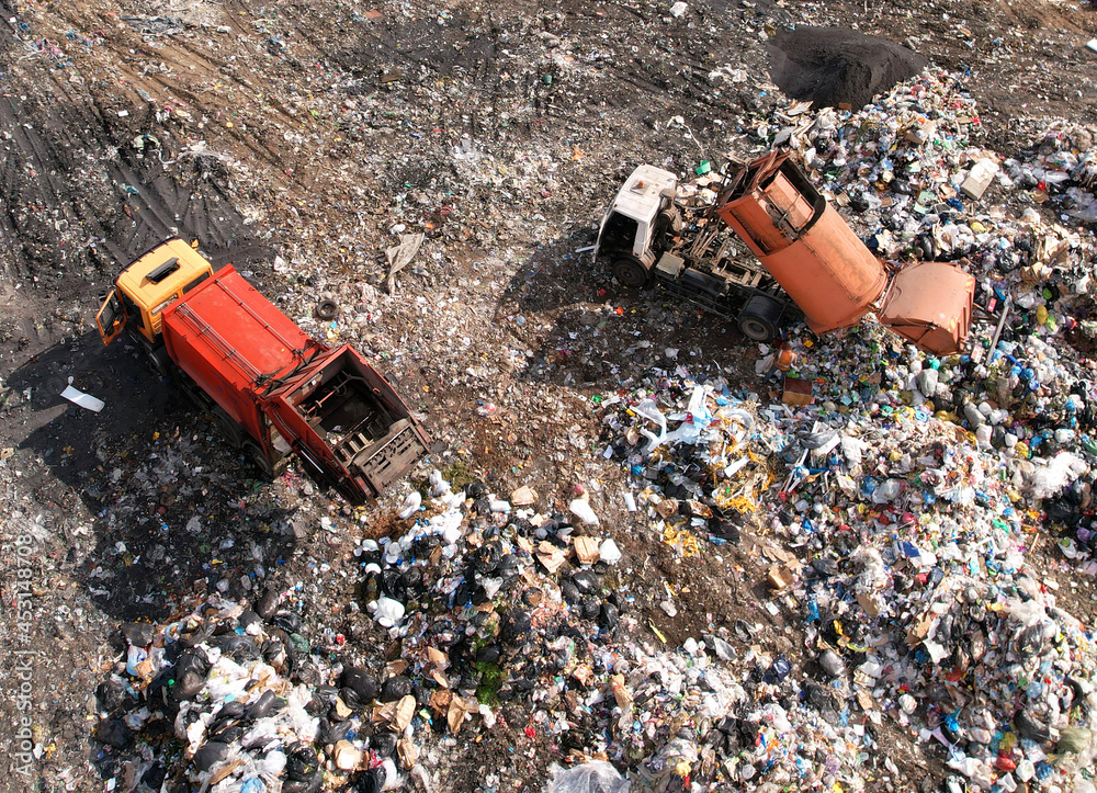 Garbage dump with food waste. Arial view of garbage truck unloads ...