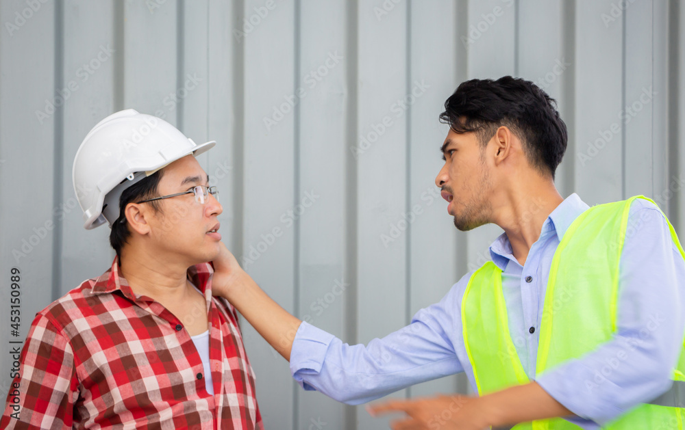 Engineers and workers are fighting at construction site. Workplace ...