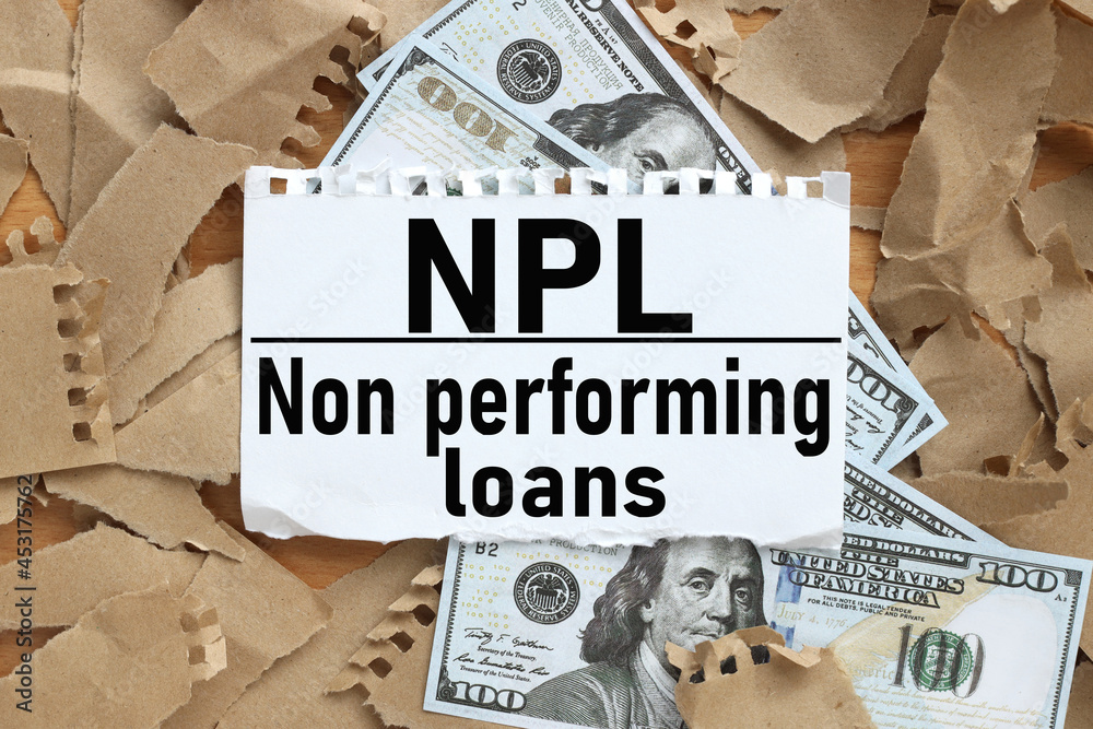 NPL as Non Performing Loan, text on white paper on torn kraft paper ...