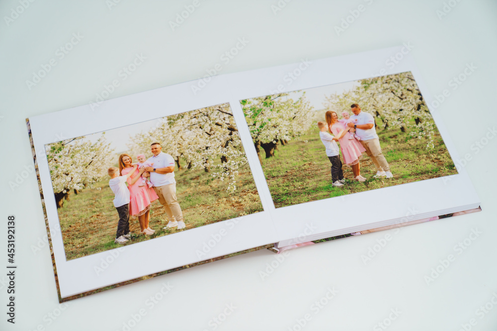 white background open photobook from family photo shoot in spring ...