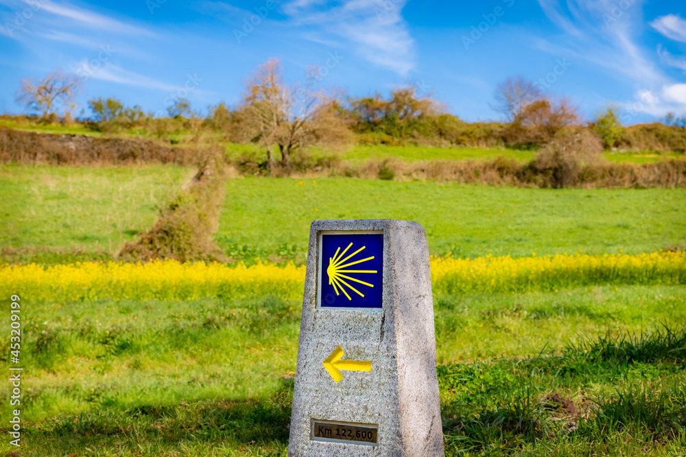 Way Marking Stone Post with Scallop Shell Symbol and Yellow Arrow Sign ...