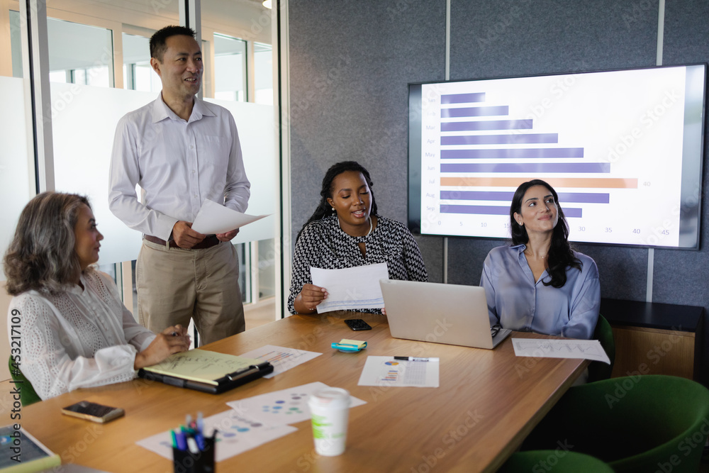 Diverse business team brainstorming and collaborates in conference room ...