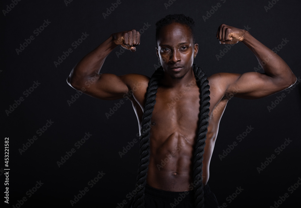 Fit African American man with muscles posing in studio Stock Photo ...