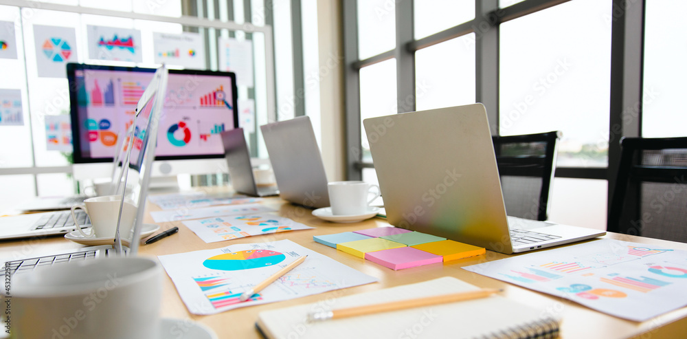 Laptop computer colorful post it paper report data graph chart ...