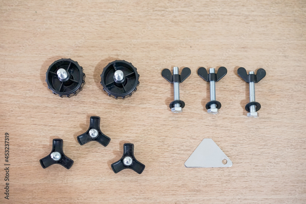 Tripod leg attachment bolts and wing nuts, thumbscrews, and screw ...