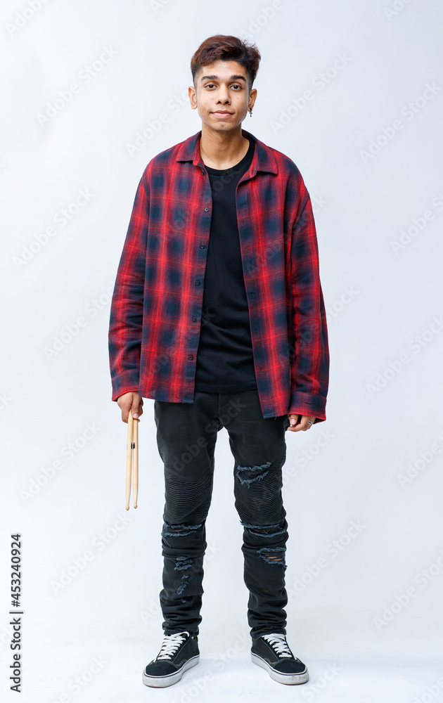 Full-body portrait shot of handsome smiling young teenage musician ...